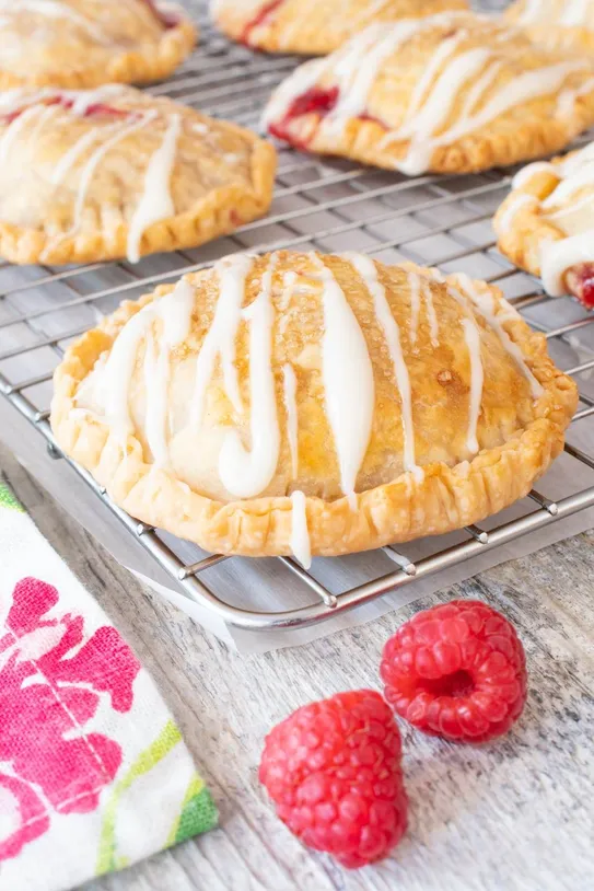 Glazed Raspberry Hand Pies | For the Love of Cooking